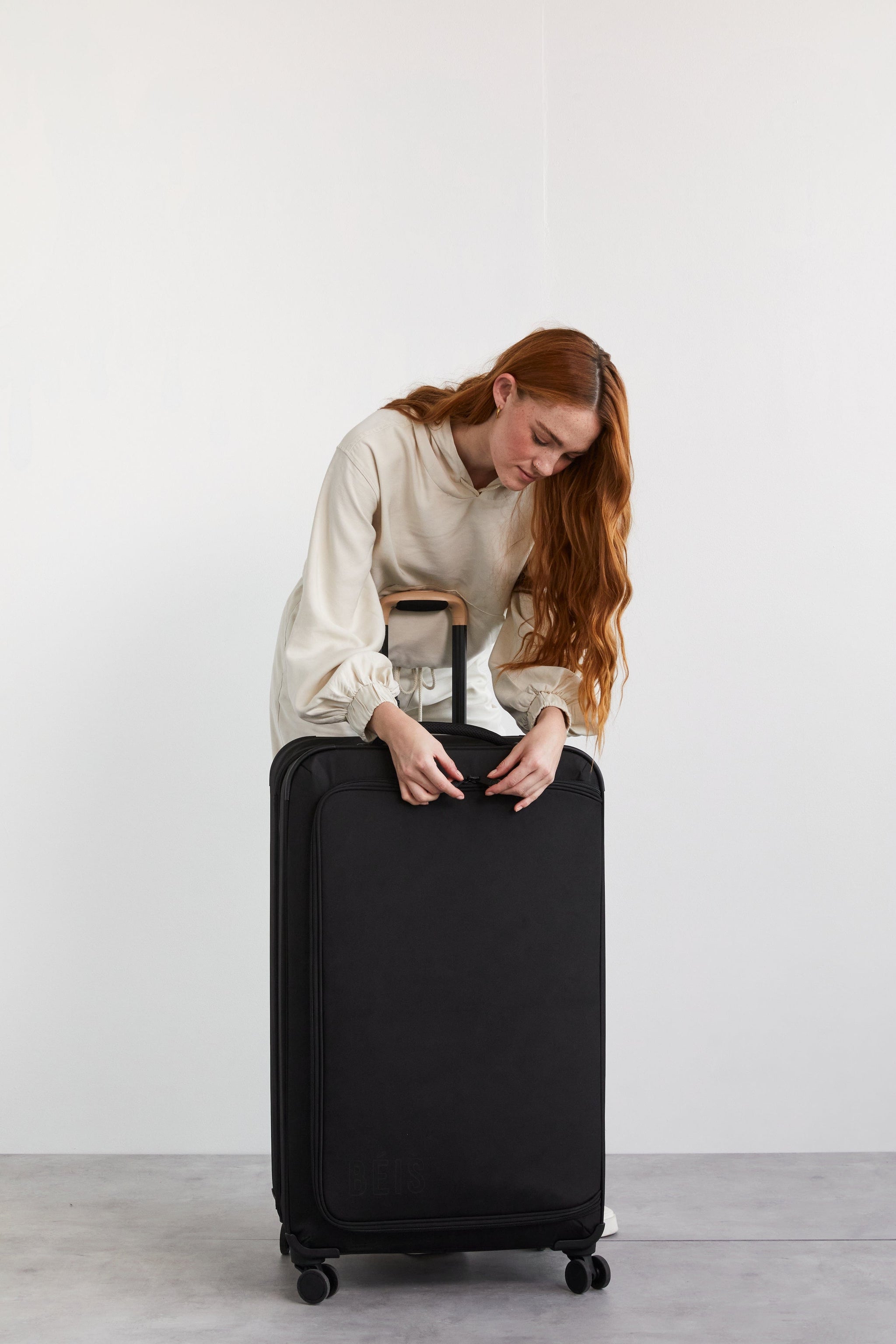 Soft-Sided Collapsible Check-In Roller in Black